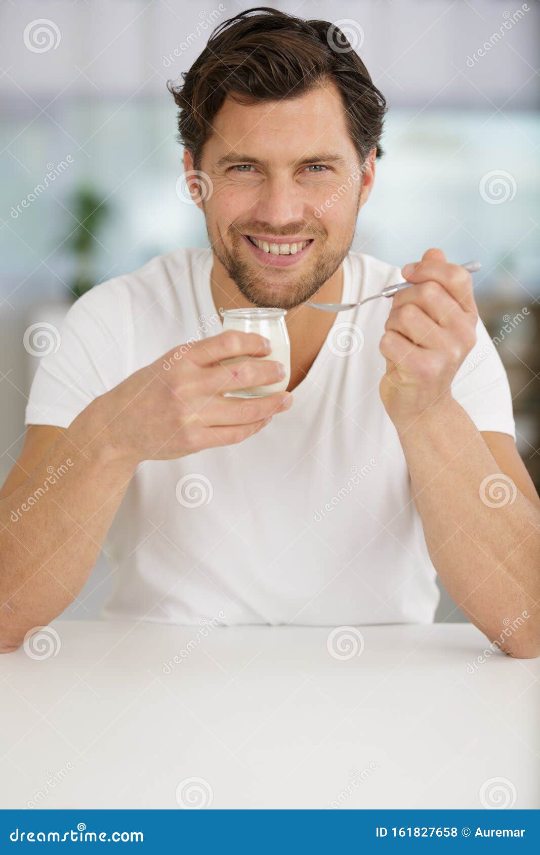 Man Eating Yoghurt from Glass Pot Stock Photo - Image of yogurt, young ...