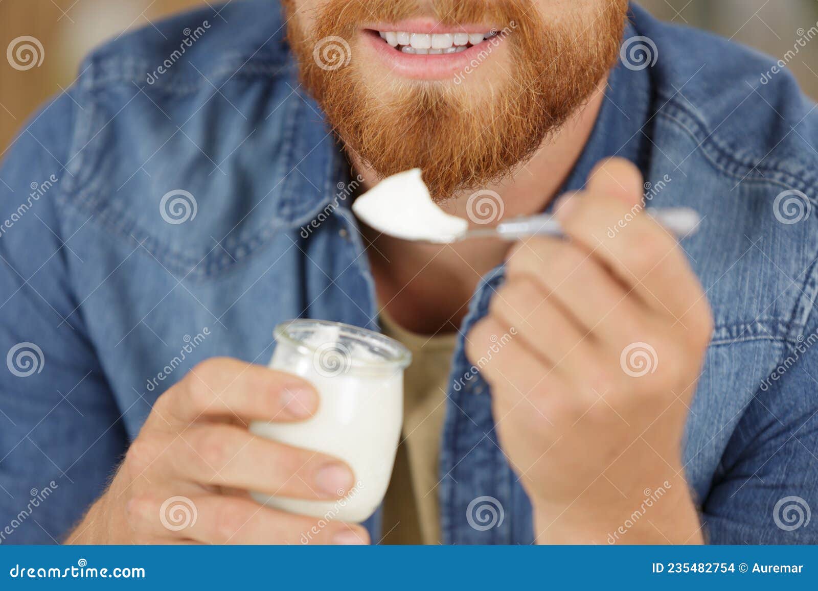 Man eating yogurt stock photo. Image of mustache, refreshment - 235482754