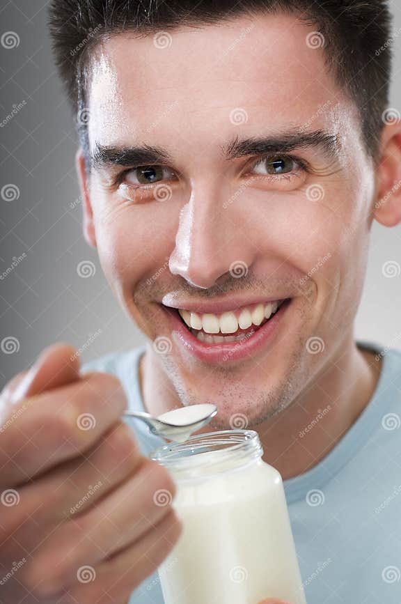 Man eating yogurt stock image. Image of hair, looking - 9047433