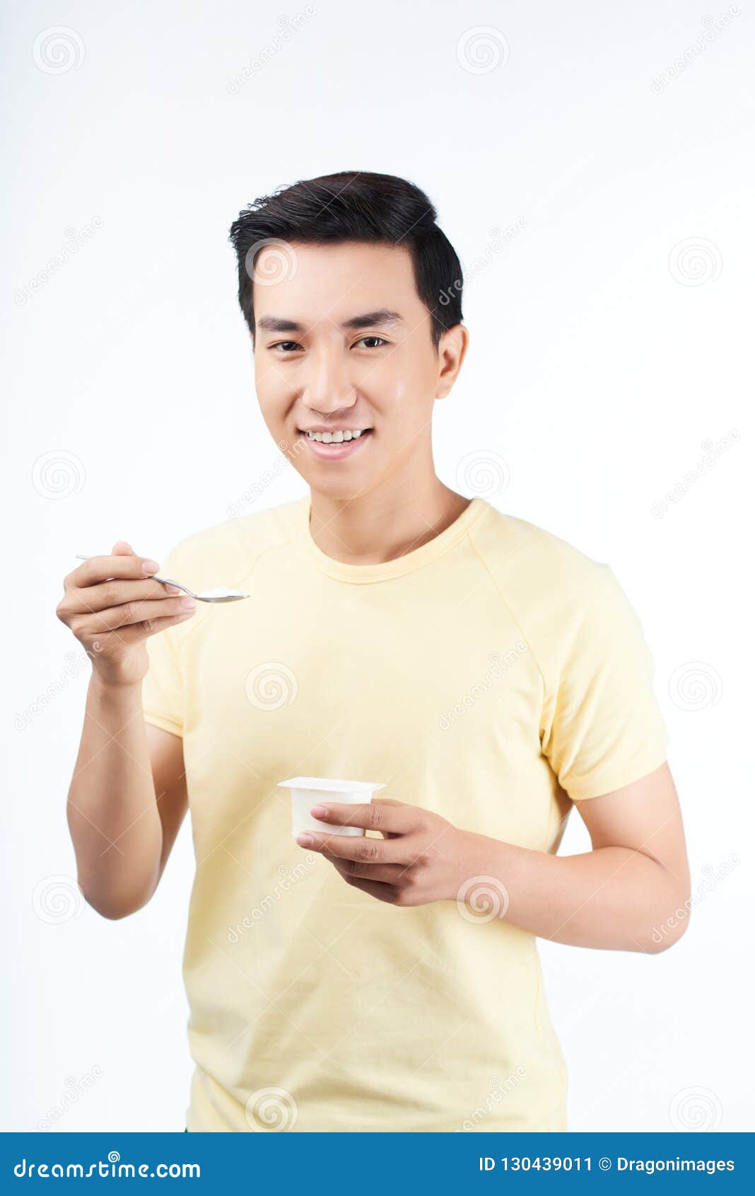 Man eating yogurt stock image. Image of breakfast, eating - 130439011