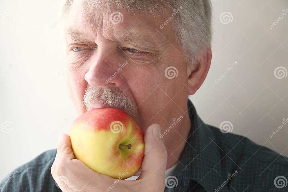 Man eats apple stock image. Image of holding, senior - 30361063