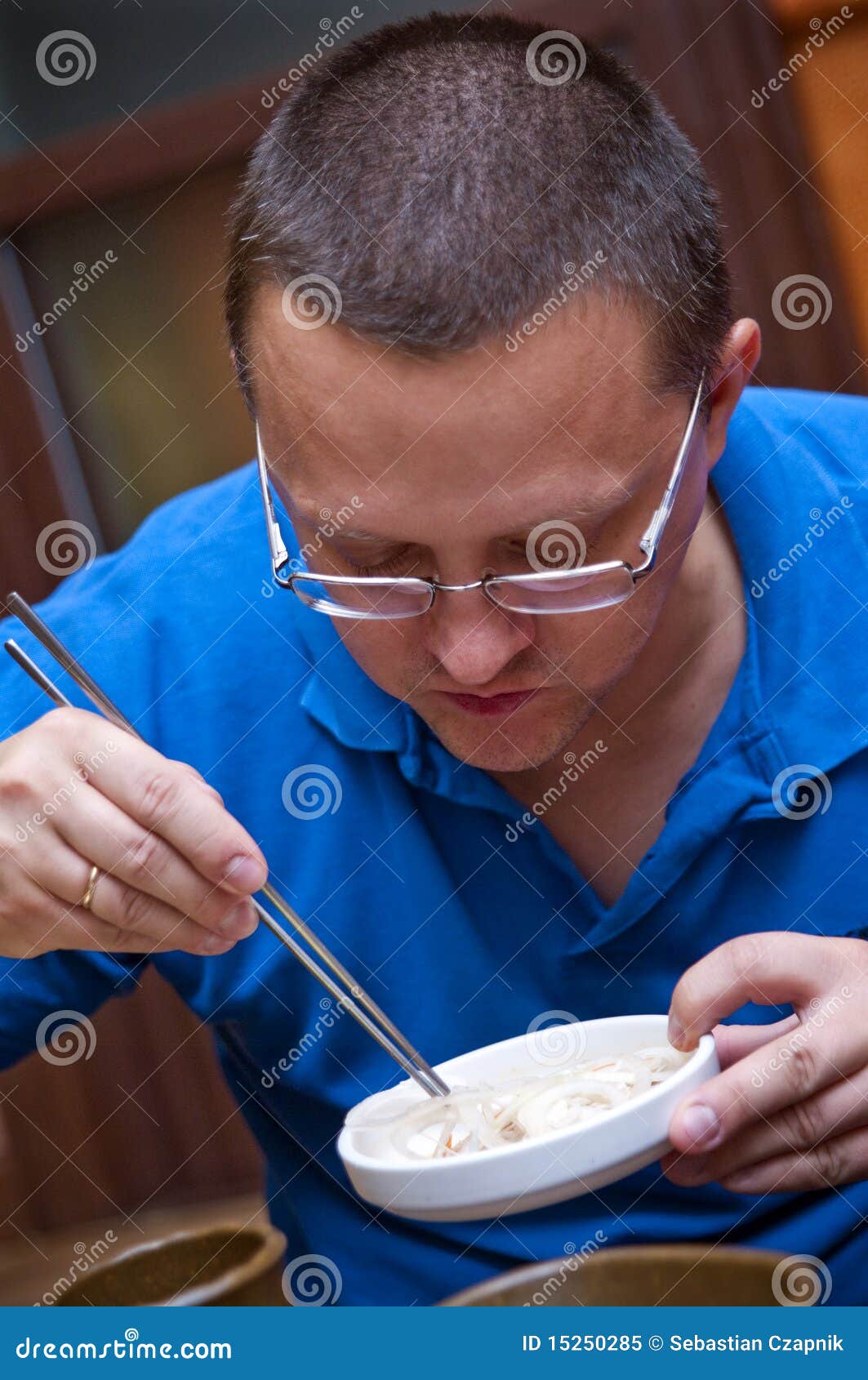 Man eats with chopsticks stock image. Image of thirties - 15250285