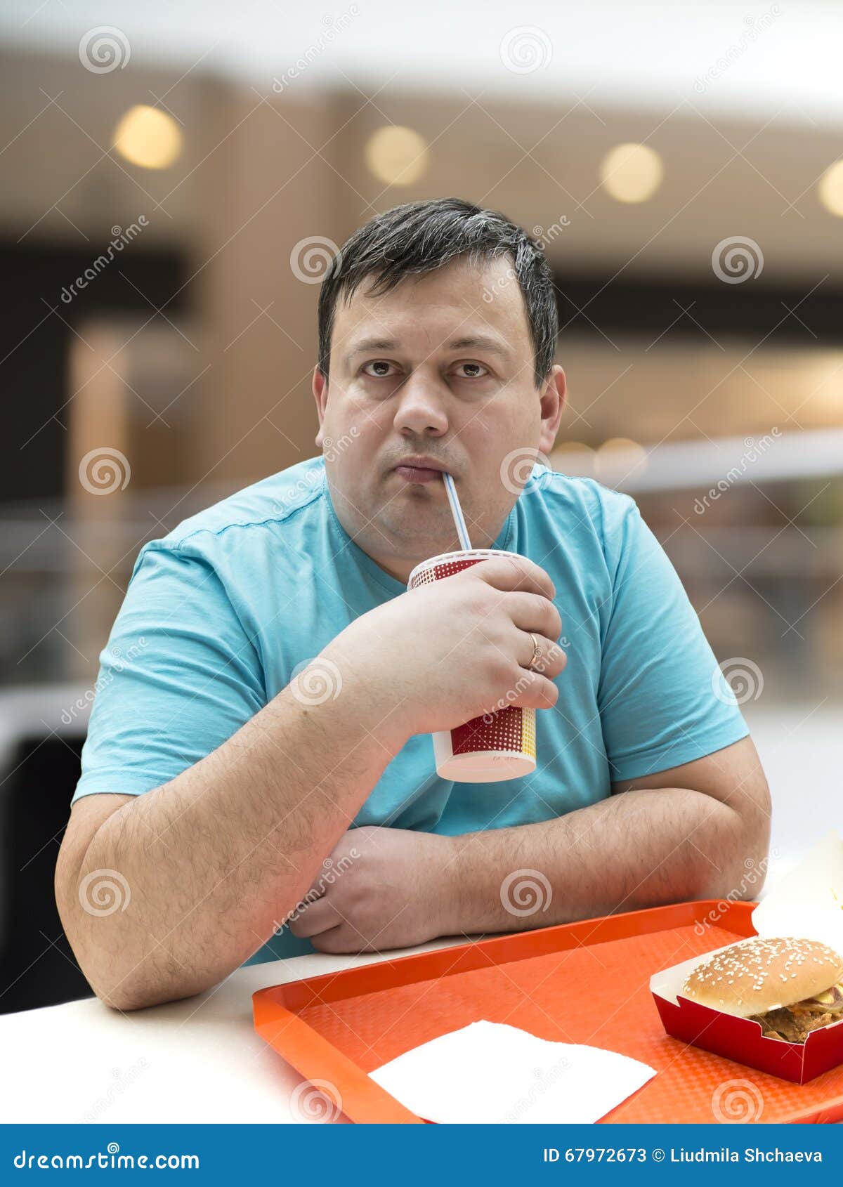The man eats fast food stock image. Image of hair, burger - 67972673