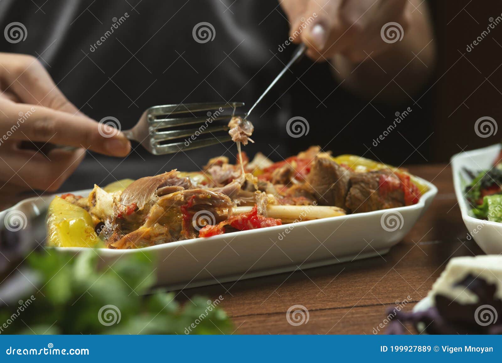 Man Eats Lamb Stew on the Bone with Vegetables Stock Image - Image of ...
