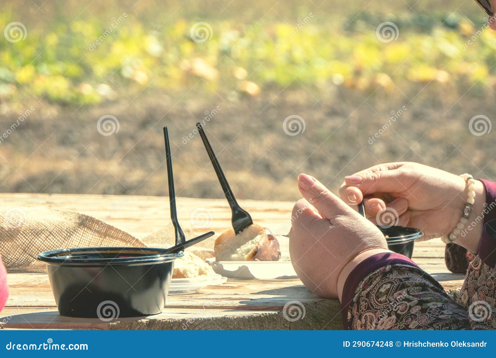 A Man Eats from Plastic Plates in an Open Space Stock Photo - Image of ...