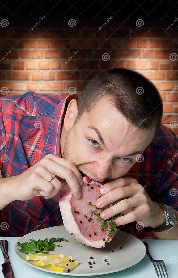 Man eats raw meat stock photo. Image of nutritious, meals - 85043148