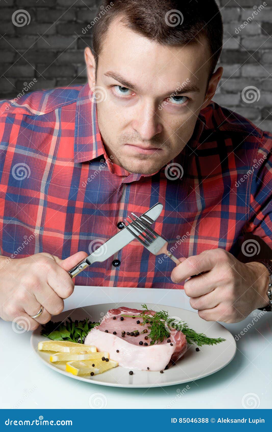 Man eats raw meat stock photo. Image of steak, cooking - 85046388