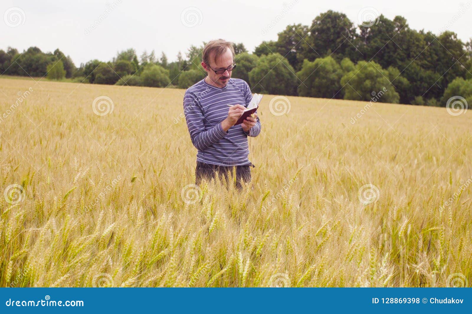 The Man Ecologist Making Notes in the Diary Stock Photo - Image of ...