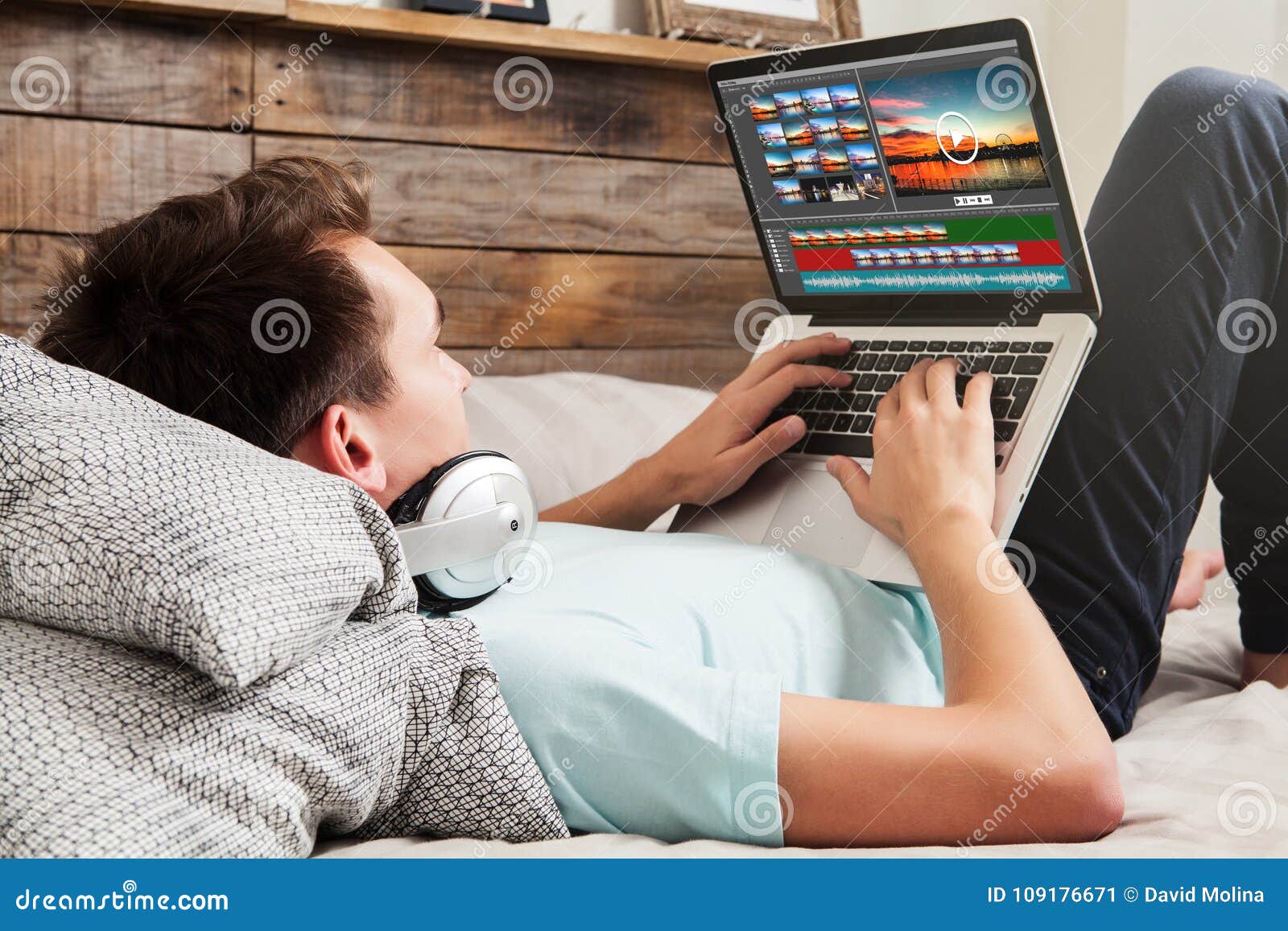 Man Editing Video with a Laptop Computer at Home. Stock Image - Image ...