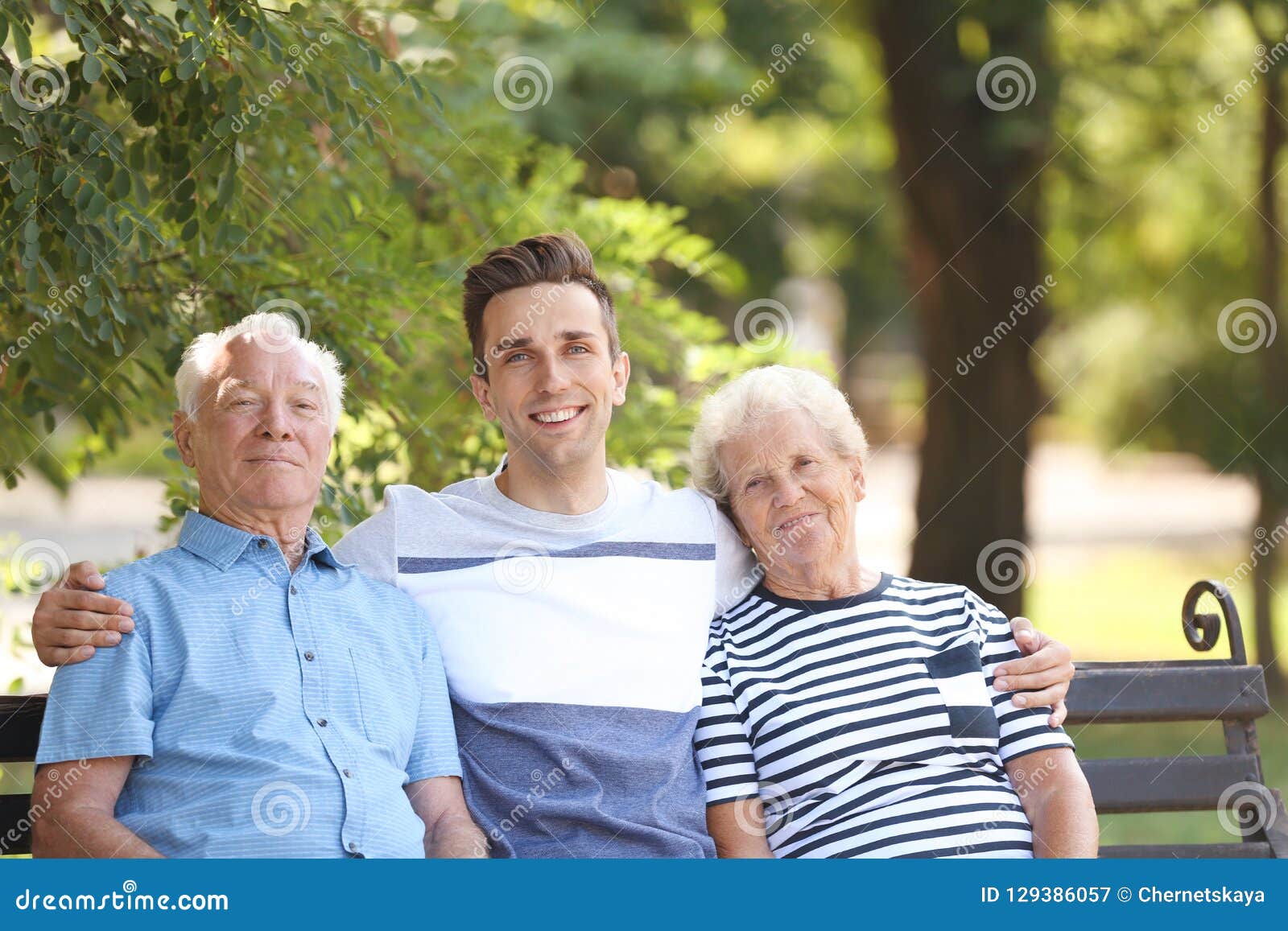 Man with Elderly Parents on Bench Stock Image - Image of generation ...