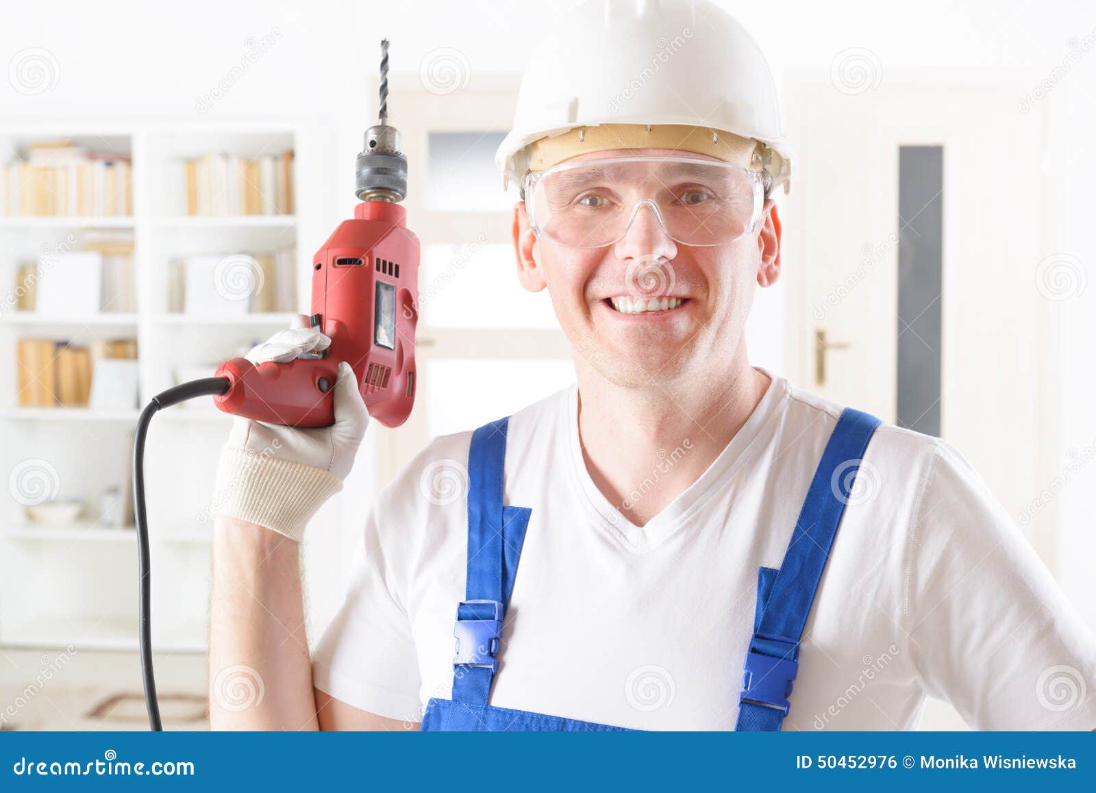 Man with electric drill stock photo. Image of drill, interior - 50452976