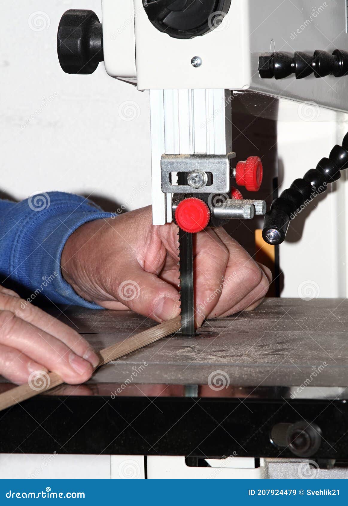 Man with an Electrical Jig Saw in an Action at the Workshop. Stock ...