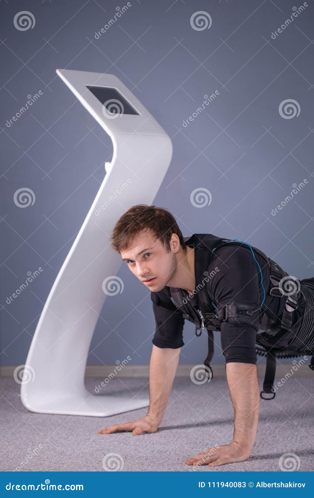 Man in Electrical Muscular Stimulation Suits Doing Plank Exercise. EMS ...