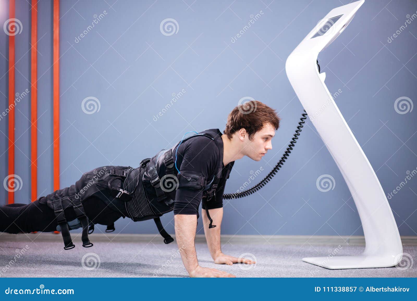 Man in Electrical Muscular Stimulation Suits Doing Plank Exercise. EMS ...