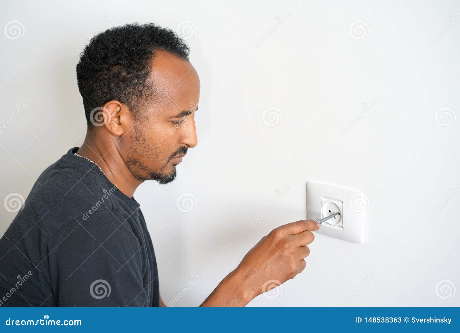 An Electrician Checks the Voltage in the Wall Socket Stock Image ...