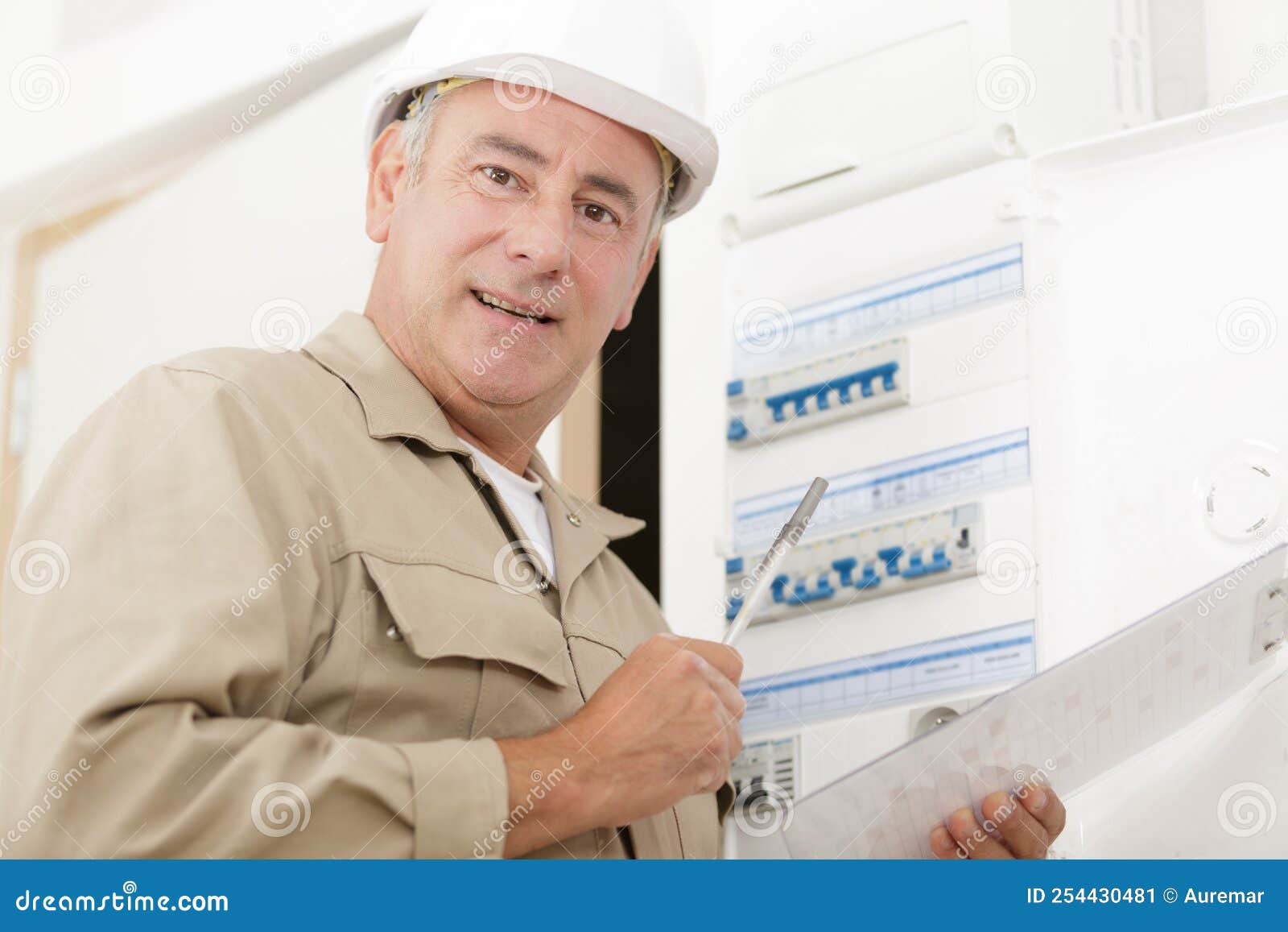 Man Electrician Working on Switchboard House Building Construction Site ...