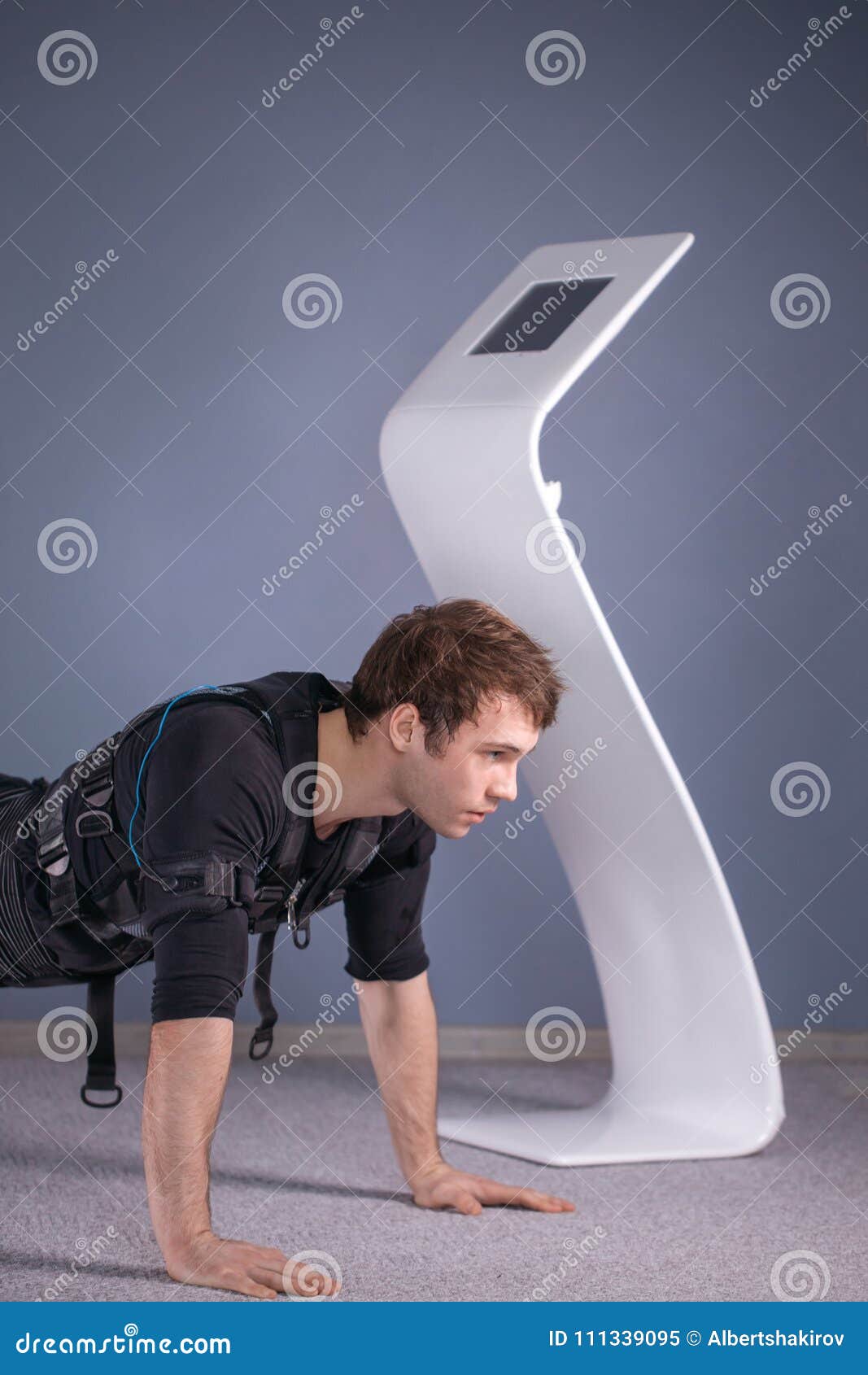 Man in Electrical Muscular Stimulation Suits Doing Plank Exercise. EMS ...