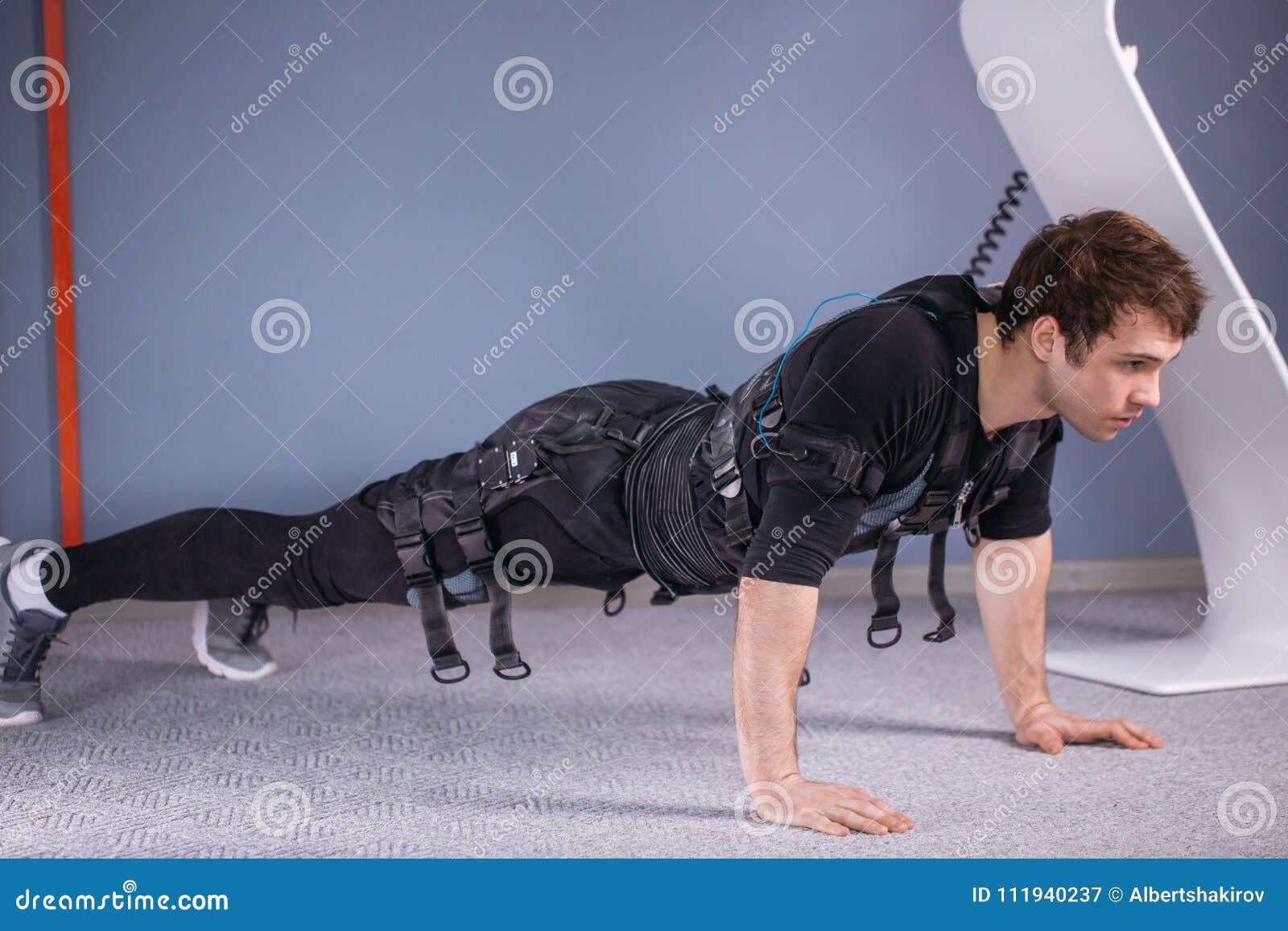 Man in Electrical Muscular Stimulation Suits Doing Plank Exercise. EMS ...