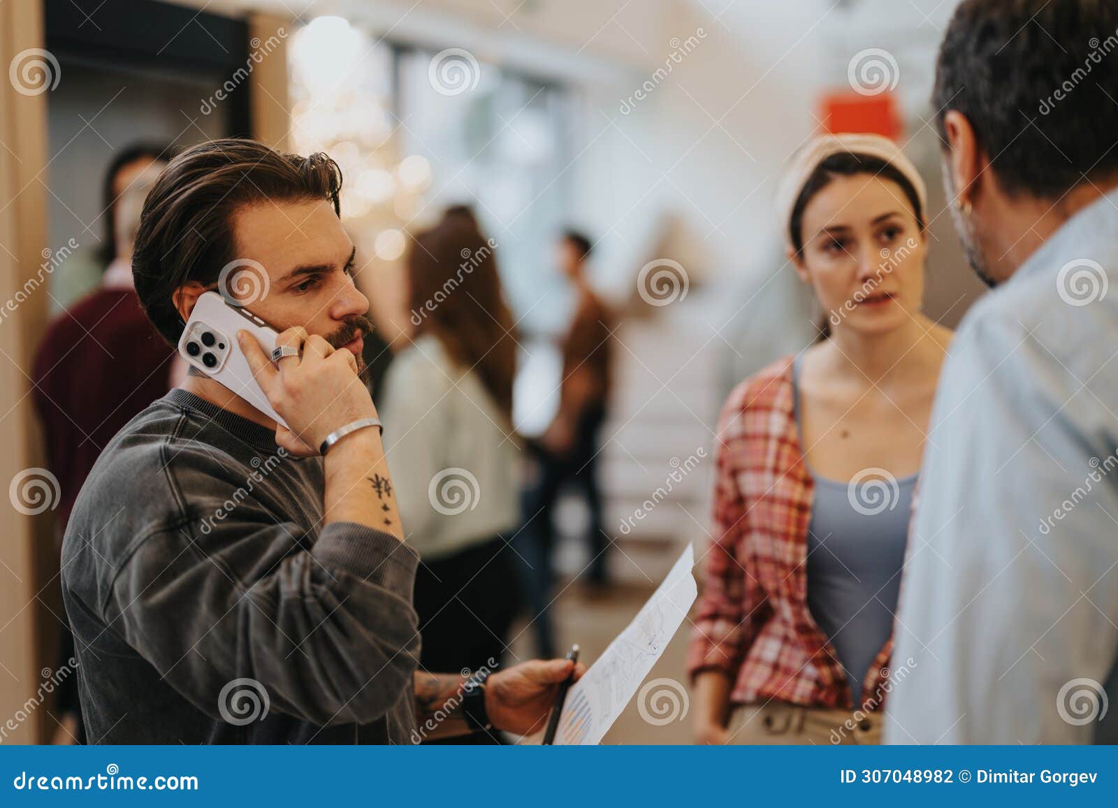 Focused Man Talking on Phone during Business Meeting in Modern Office ...