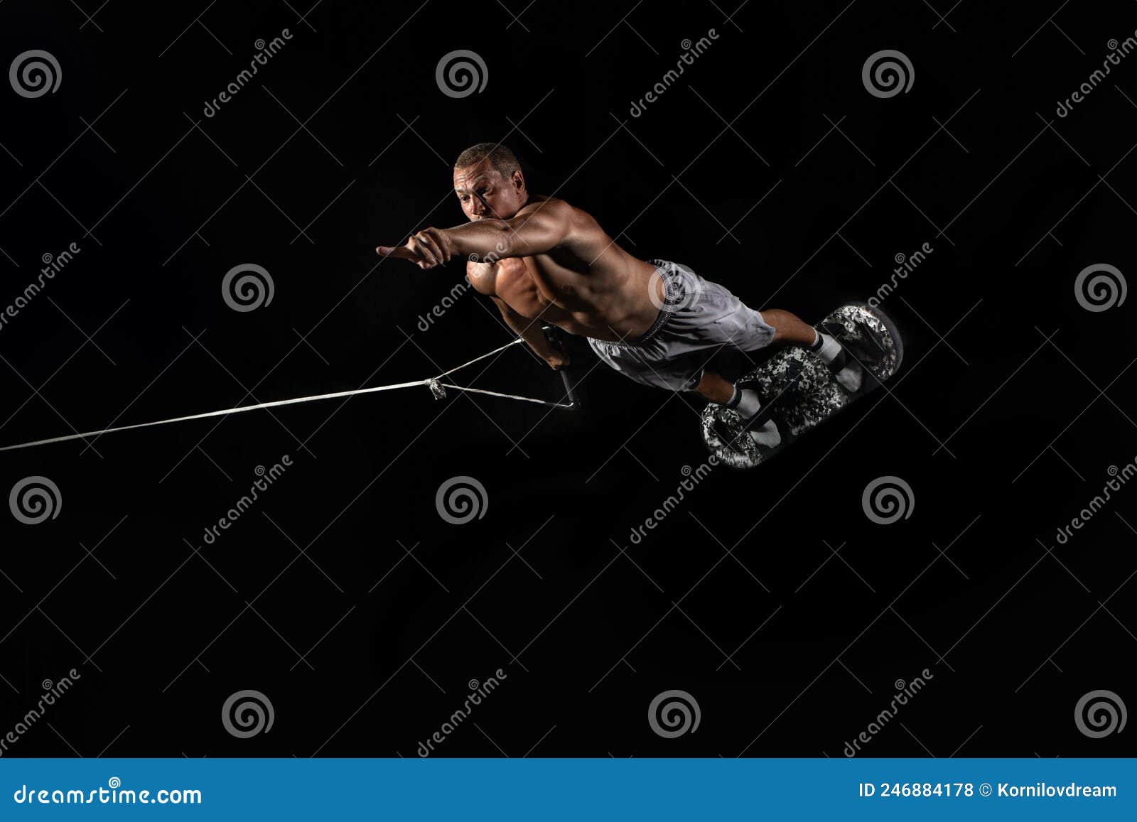 A Man is Engaged in Trampoline Jumping on a Rubber Board and Pointing ...