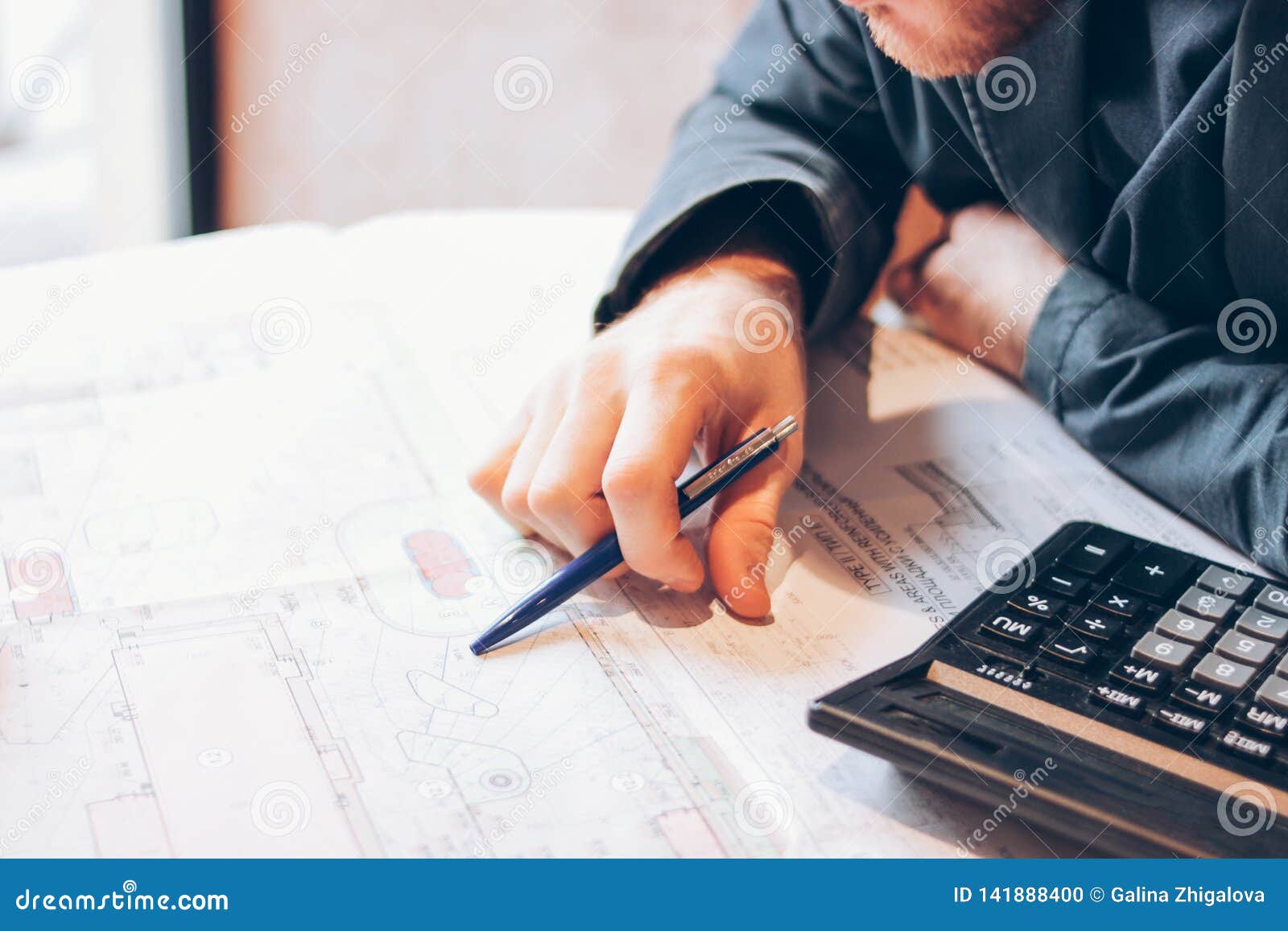 Man Engineer Designer Architect Reading Drawings at Table Stock Photo ...