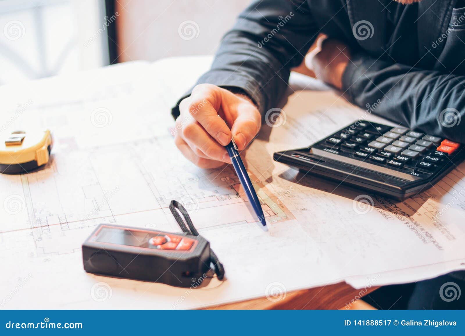 Man Engineer Designer Architect Reading Drawings at Table in Cafe Stock ...