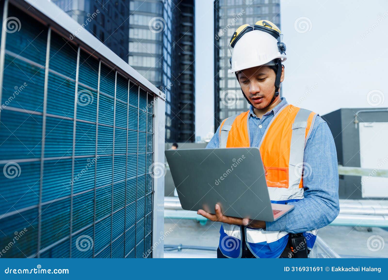 Man Engineer Holding Laptop Working at Rooftop Building Construction ...