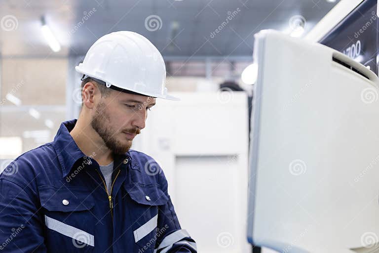 Man Engineer Using Computer Controlling Cnc Machine at Workshop. Professional Male Control ...