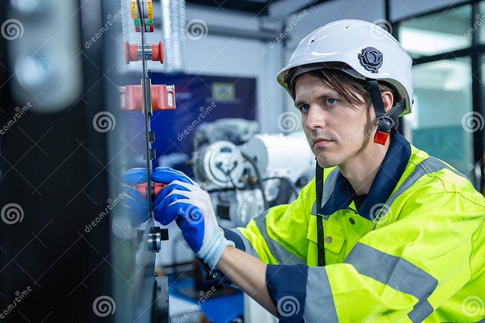 Man Engineer Using Computer Controlling Machine Automation Robotics at ...
