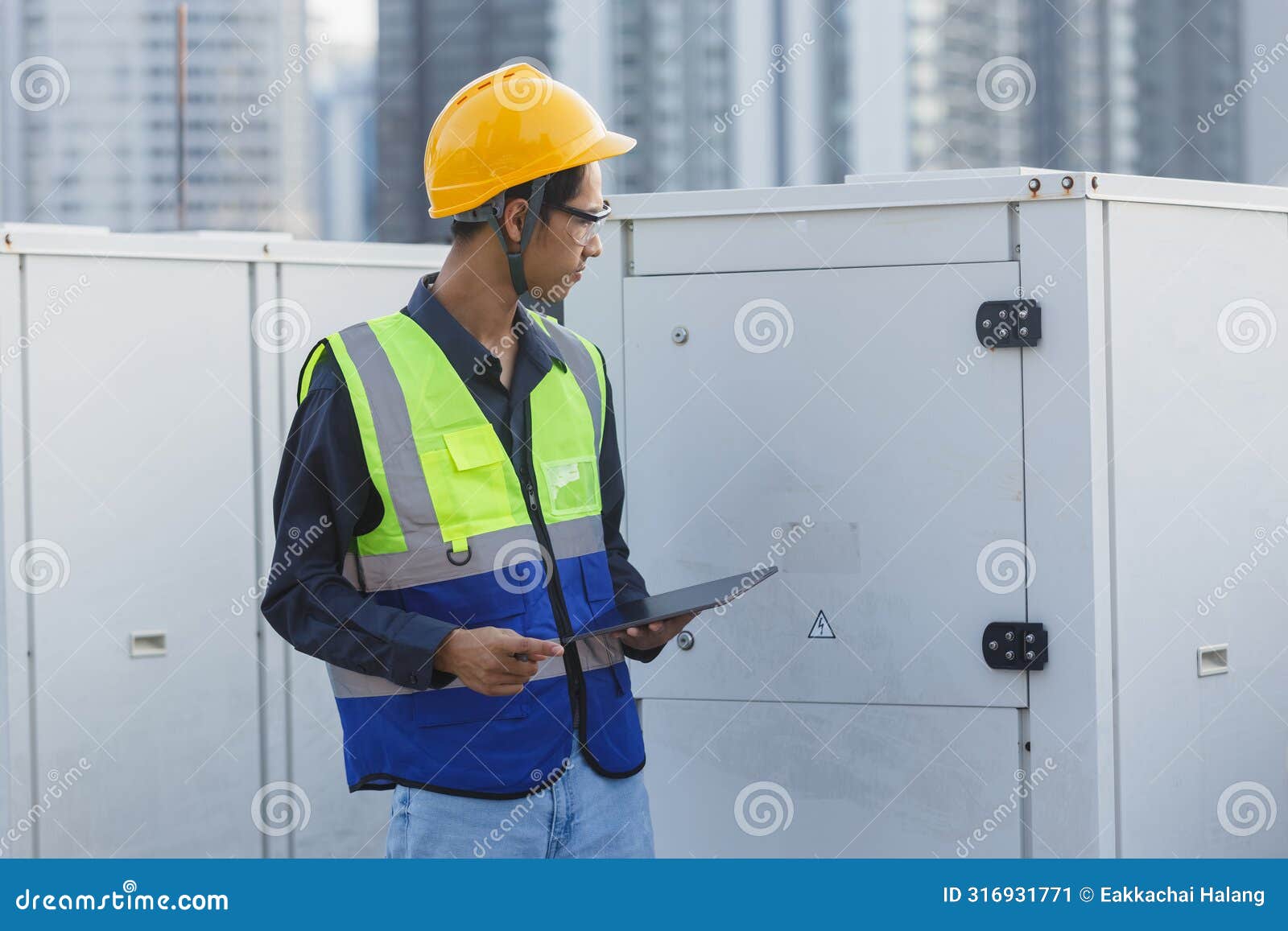 Man Engineer Using Tablet Working at Rooftop Building Construction. Male Technician Worker ...