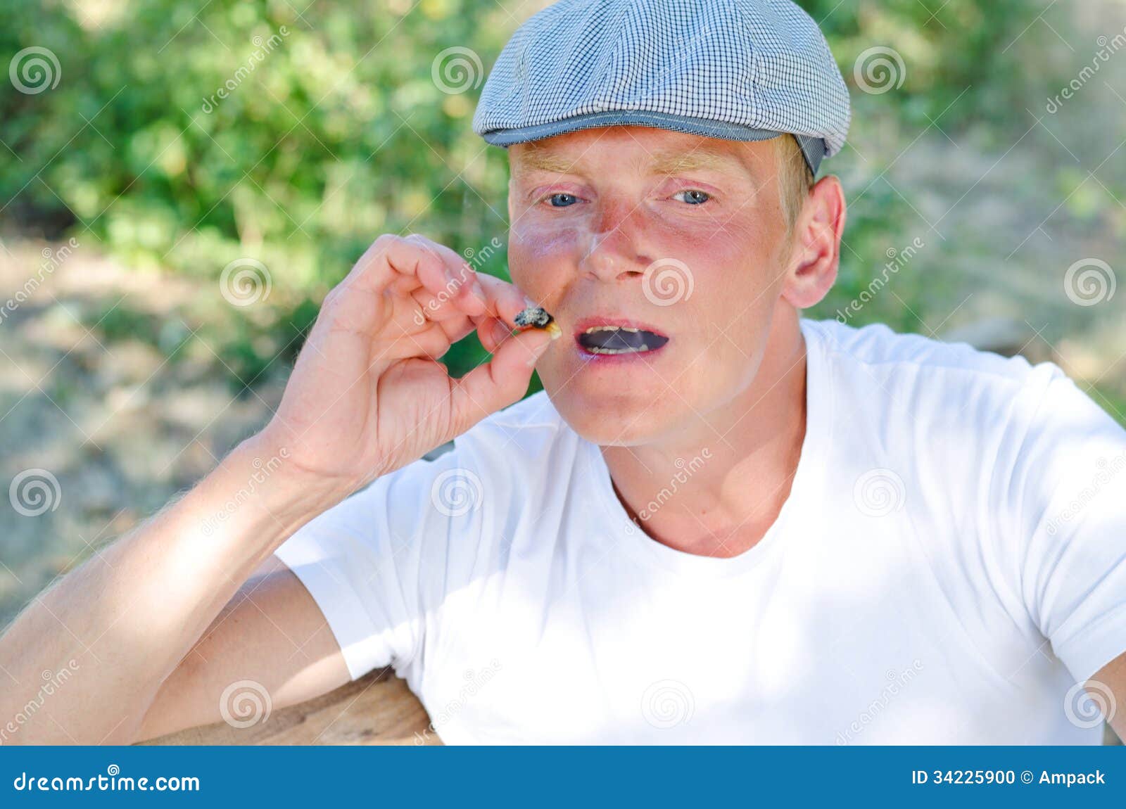 Man enjoying a cigarette stock photo. Image of nicotine - 34225900