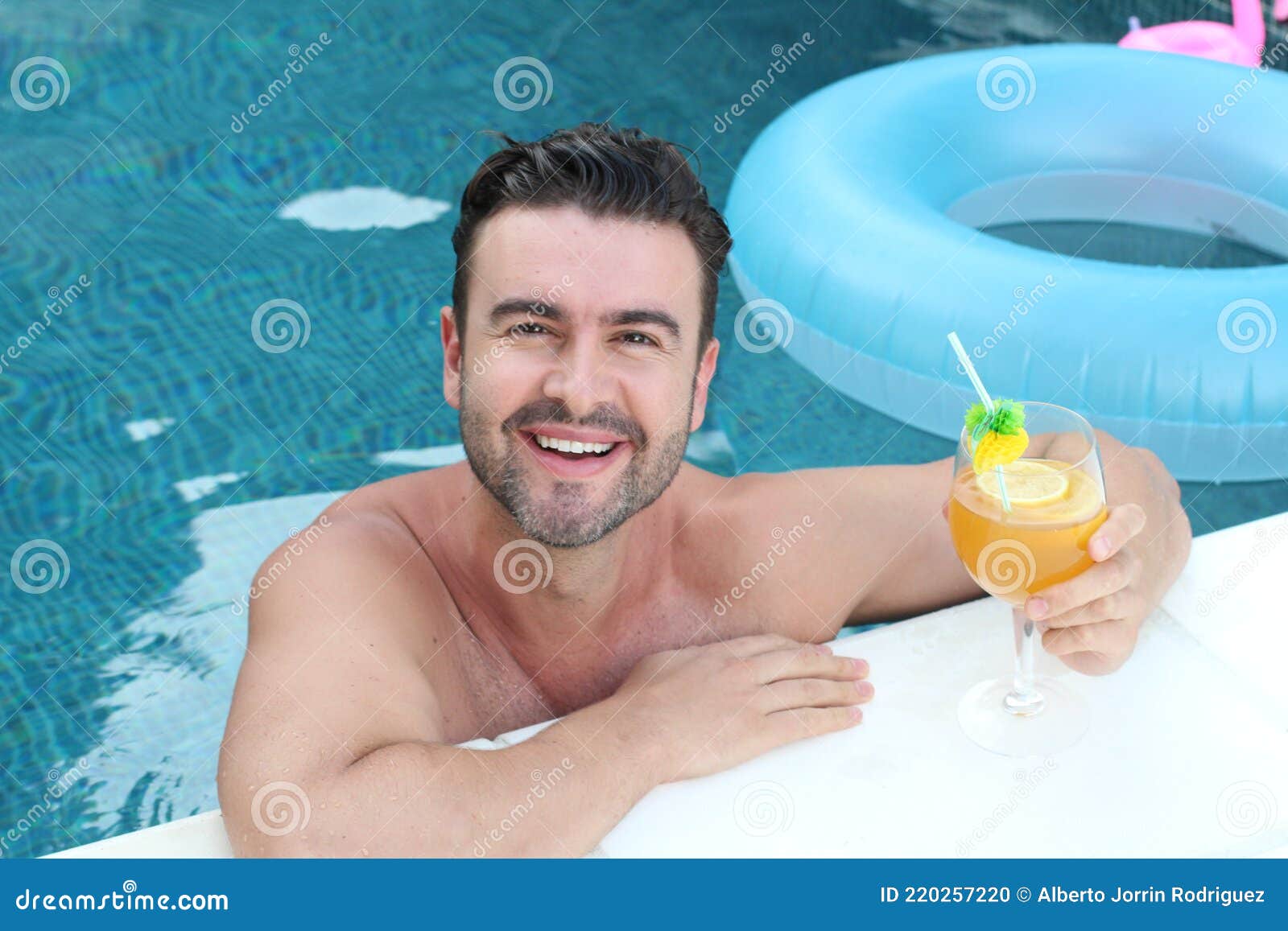 Man Enjoying a Fresh Alcoholic Drink in Swimming Pool Stock Photo ...