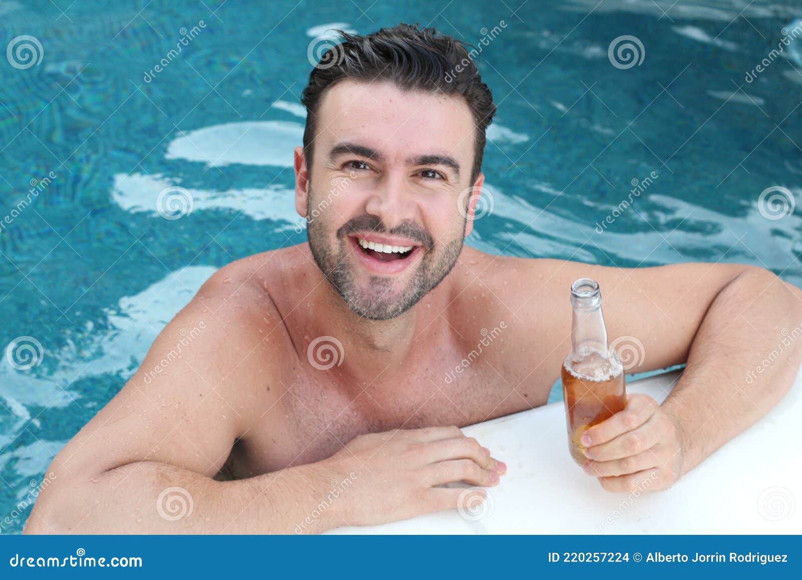 Man Enjoying a Fresh Alcoholic Drink in Swimming Pool Stock Photo ...