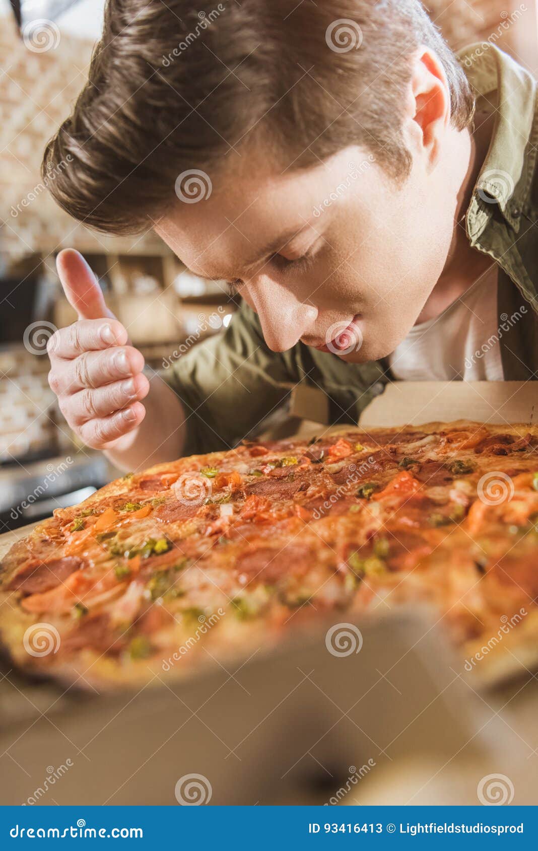Man enjoying fresh pizza stock image. Image of food, person - 93416413