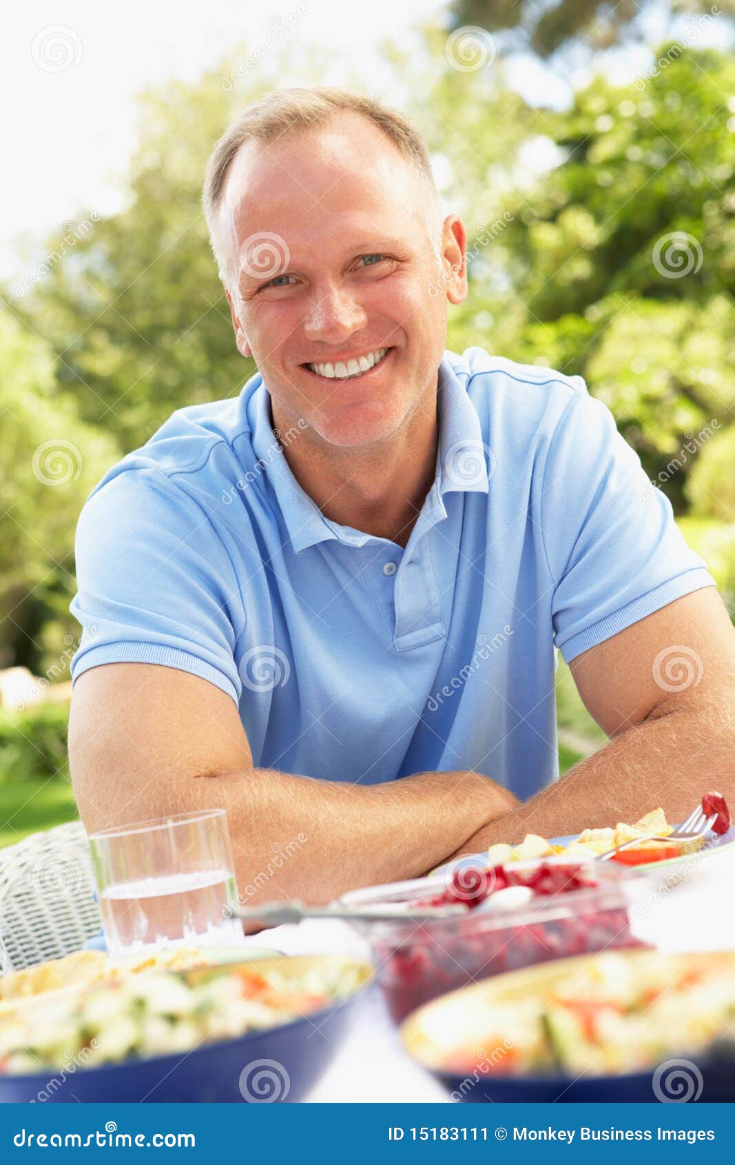 Man Enjoying Meal in Garden Stock Image - Image of outdoors, picnic ...