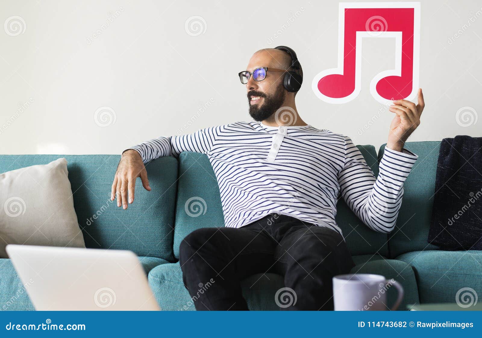 Man enjoying music at home stock photo. Image of emotion - 114743682