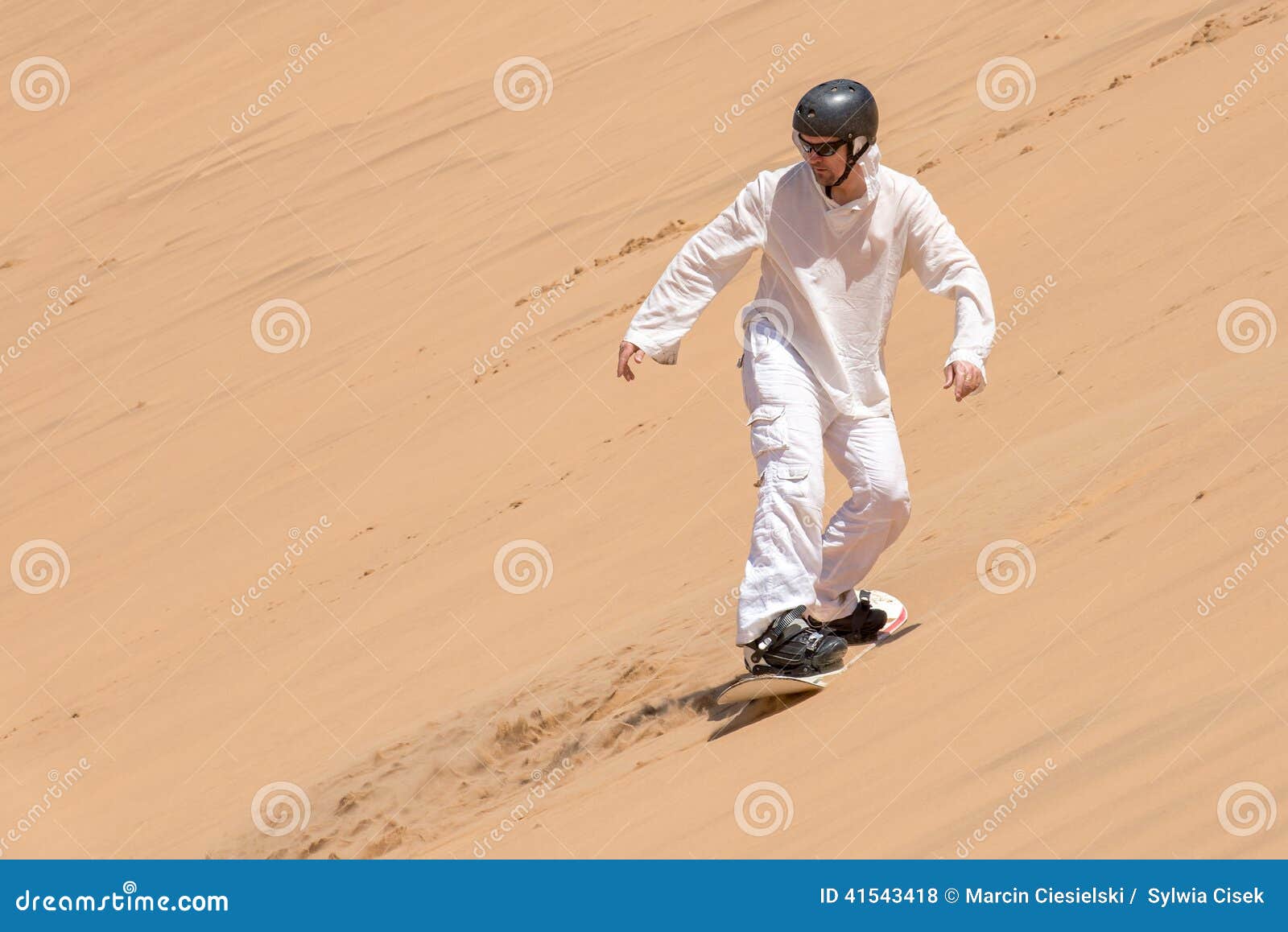 Man enjoying sandboarding stock photo. Image of board - 41543418