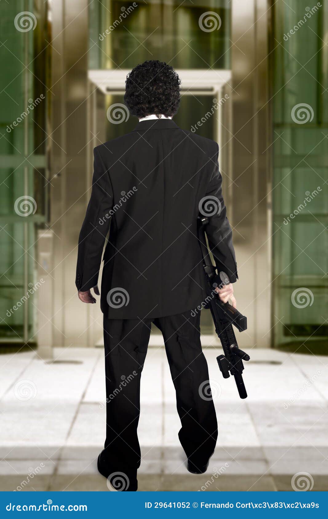Man Entering a Business Building with a Machine Gun Stock Photo - Image ...