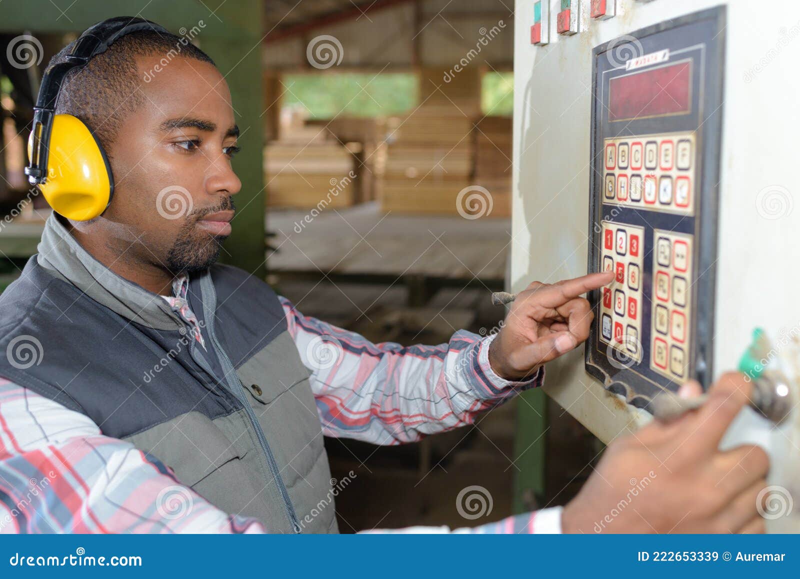 Man Entering Code into Electrical Box Stock Image - Image of noisy ...
