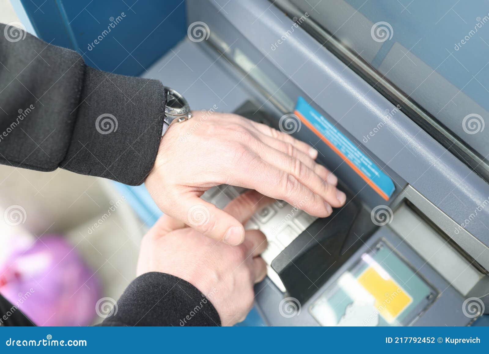 Man Enters Code on ATM Keyboard and Closes it with His Hand Stock Photo ...