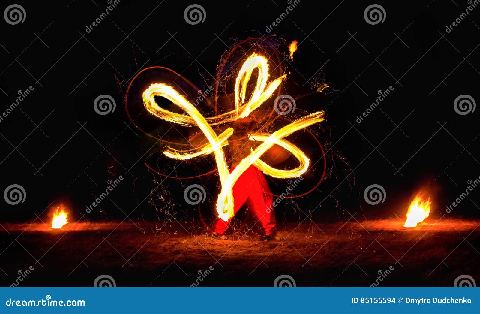 Man Entertains Audience with the Help of Fire Carrying Fire Performance ...