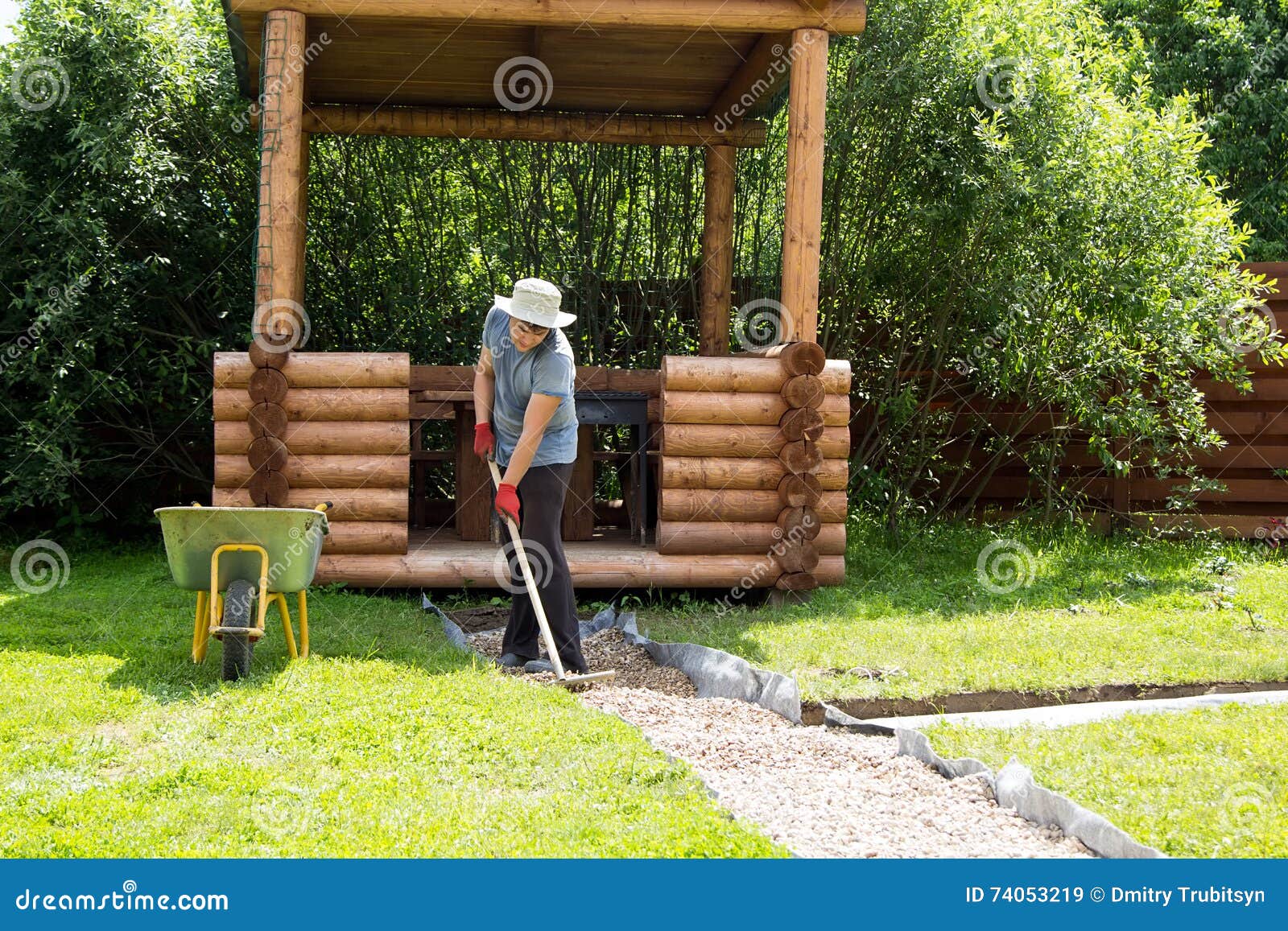 Man Evens Gravel on Path with Rake Stock Image - Image of building ...