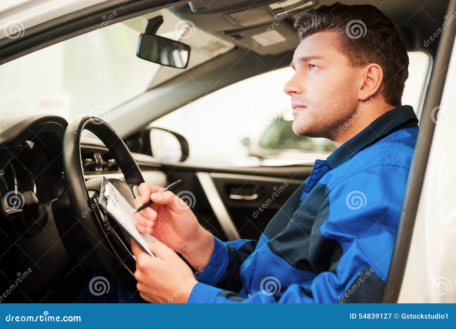 Man examining car. stock image. Image of male, auto, inside - 54839127