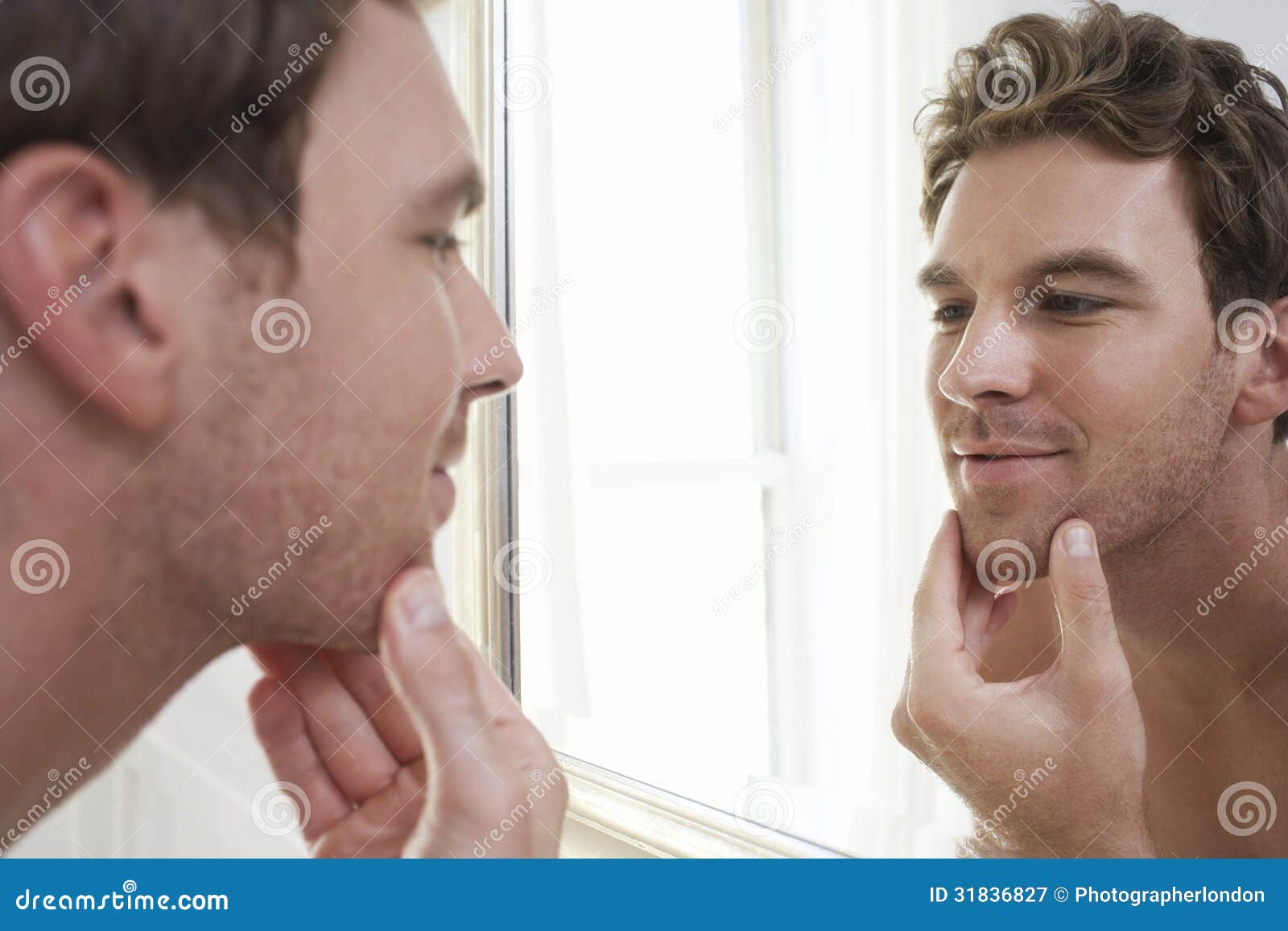 Man Examining His Stubble in Mirror Stock Image - Image of routine ...