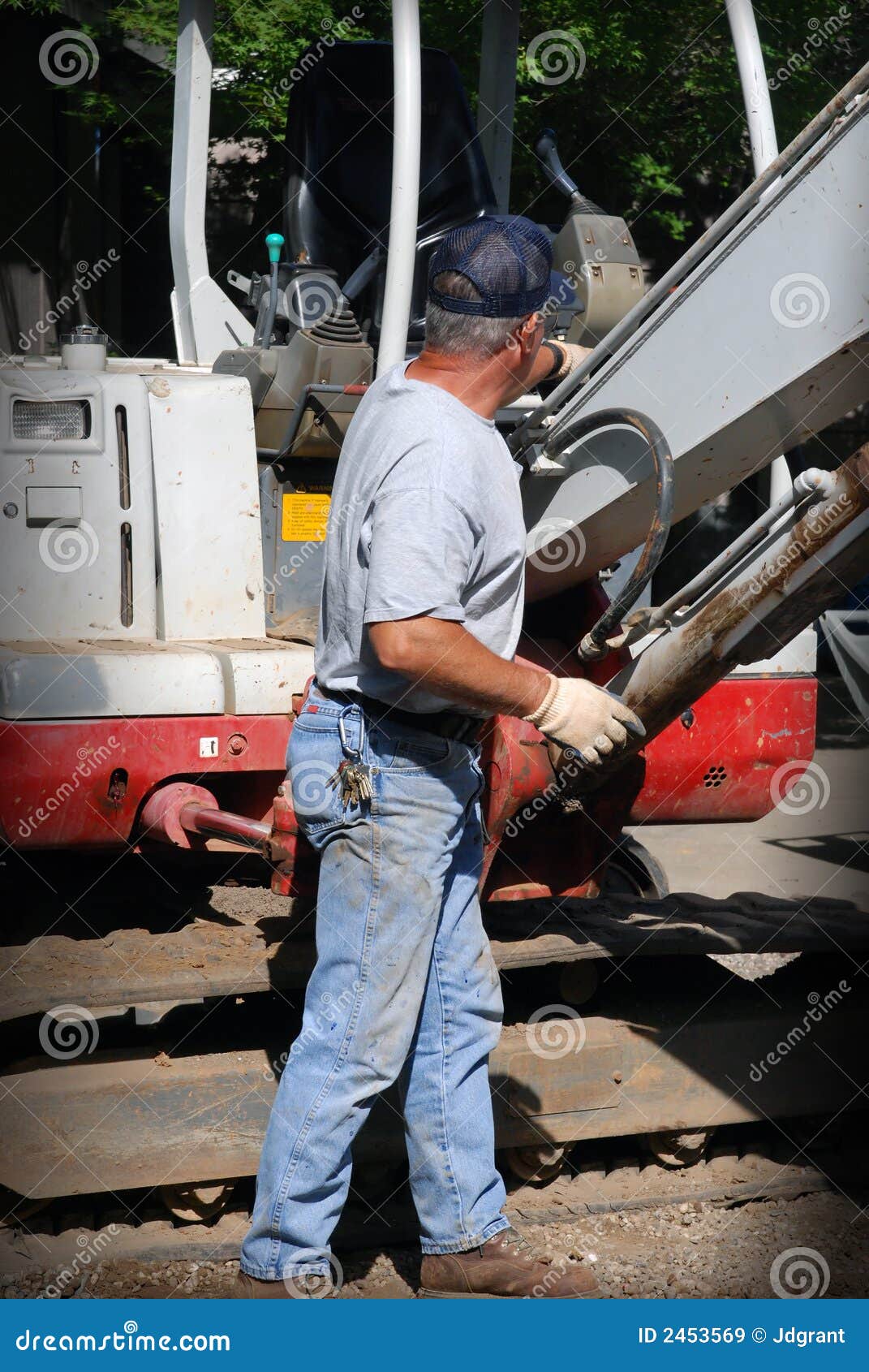 Man with excavator stock image. Image of masculine, excavate - 2453569