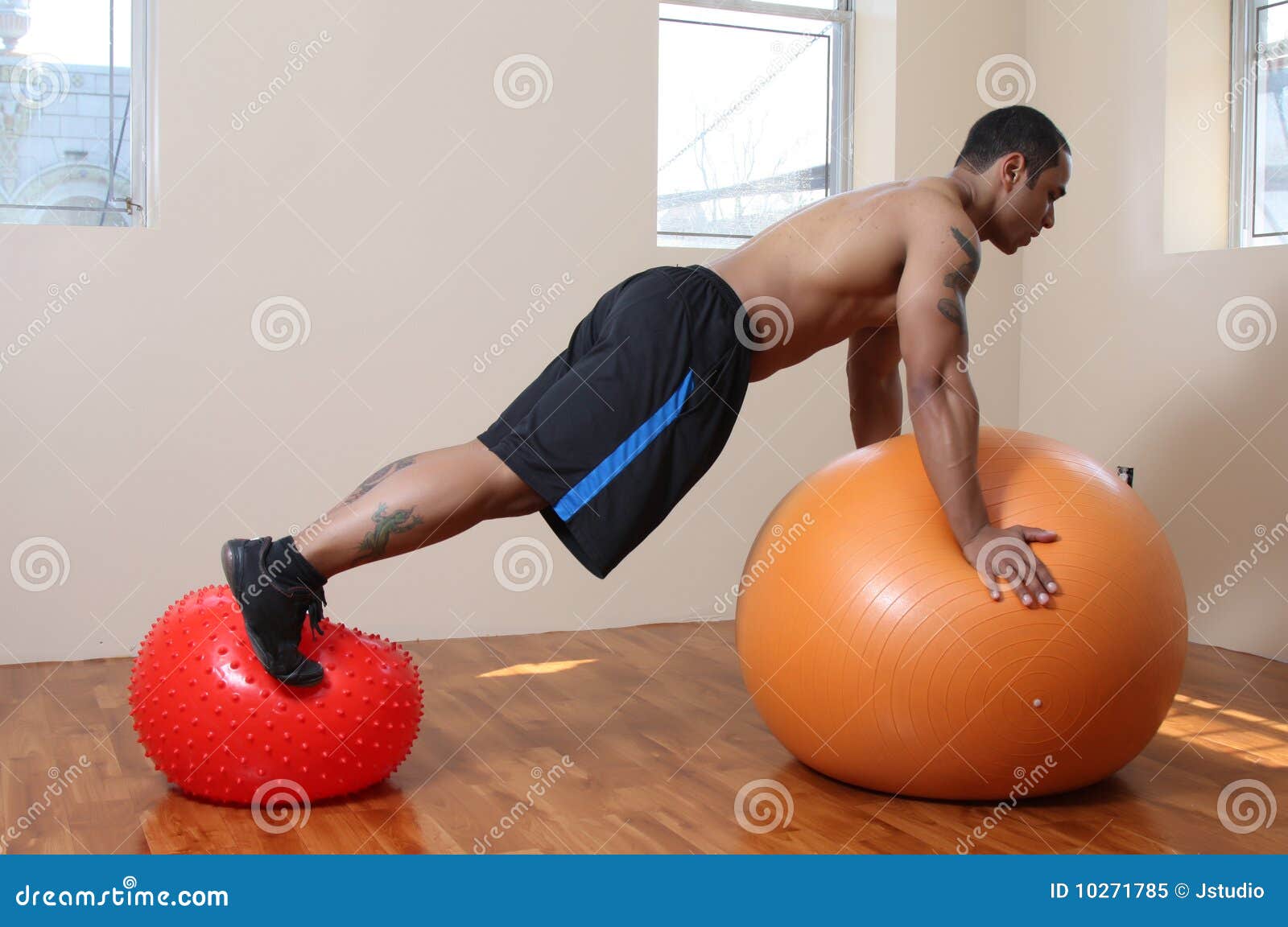 Man with exercise balls stock image. Image of strong - 10271785