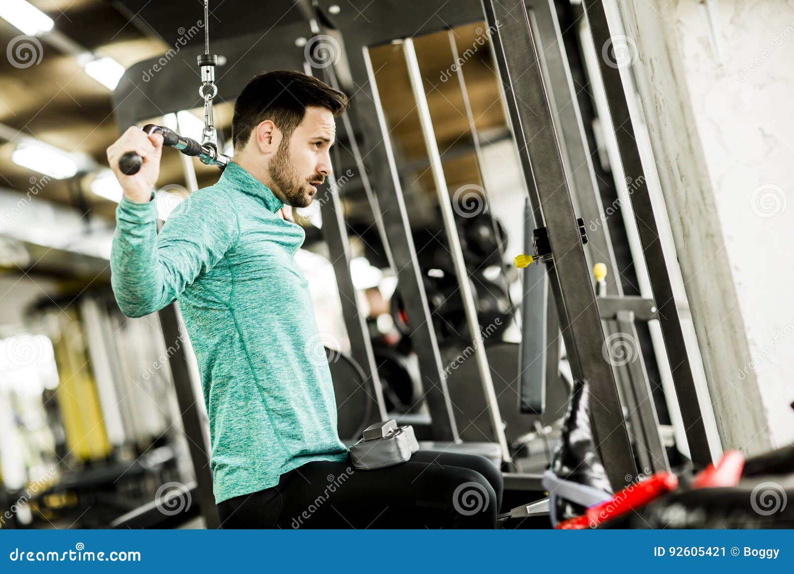 Man Exercise on an Exercise Machine at the Gym Stock Image - Image of ...