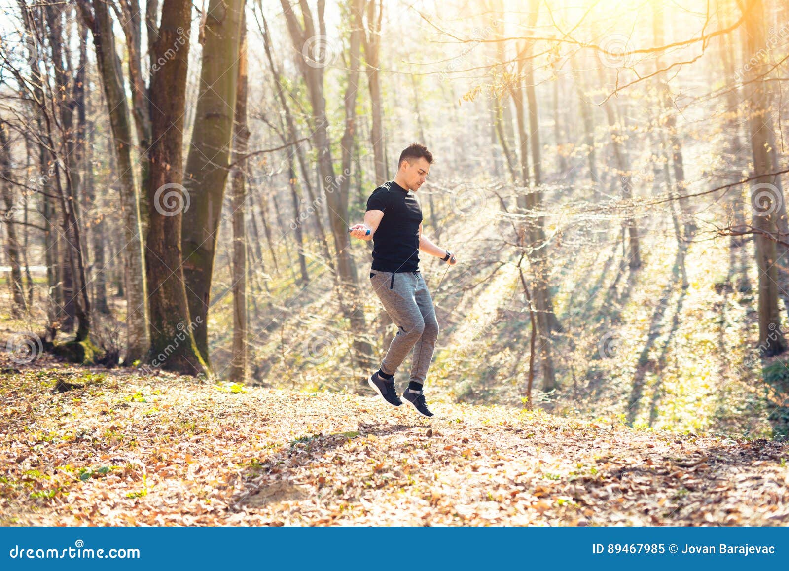A Man Exercise in Nature Skips Rope Stock Image - Image of clothing ...