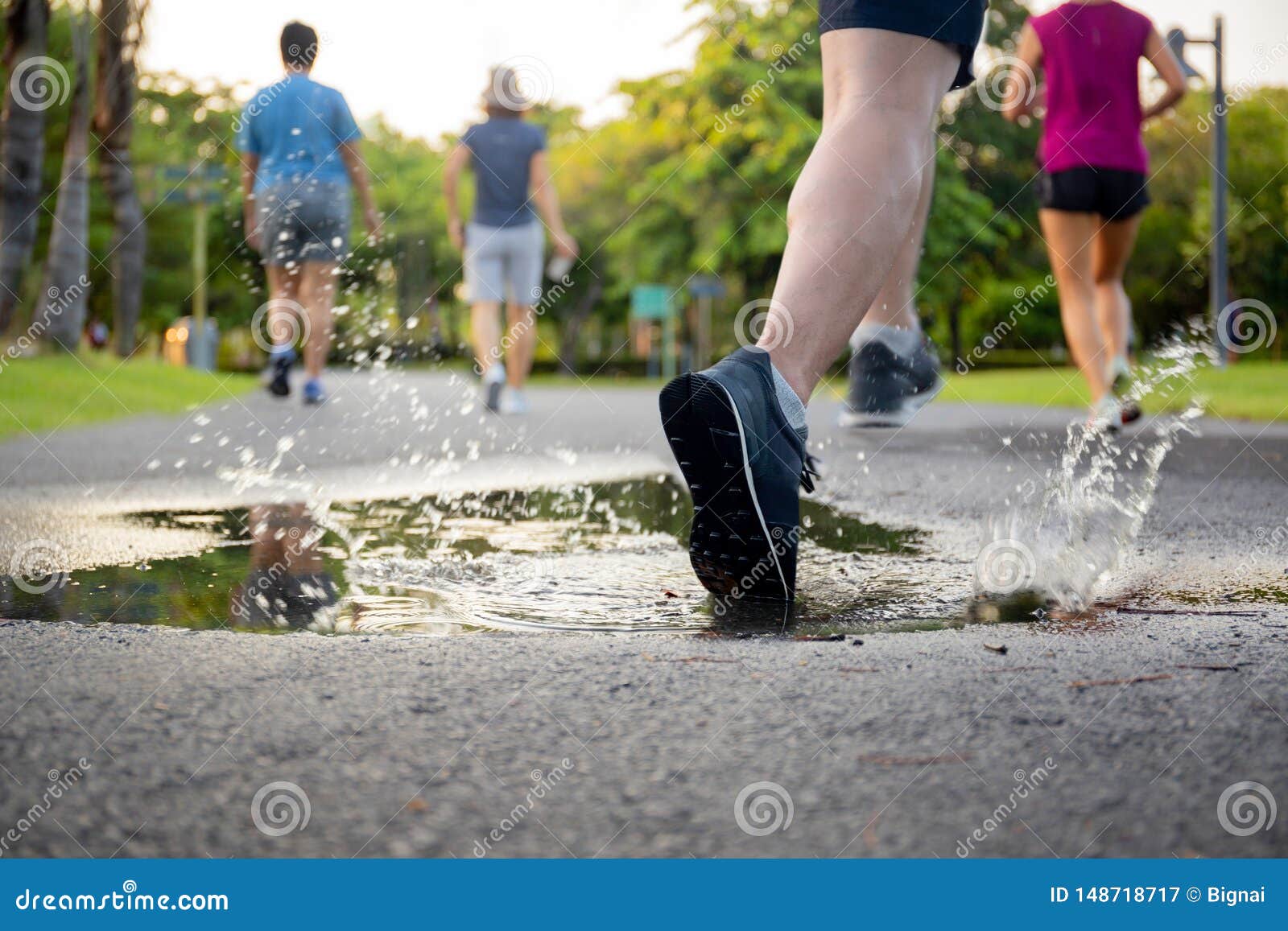 Man Exercise Running through Puddle Splashing His Shoes. Stock Image ...