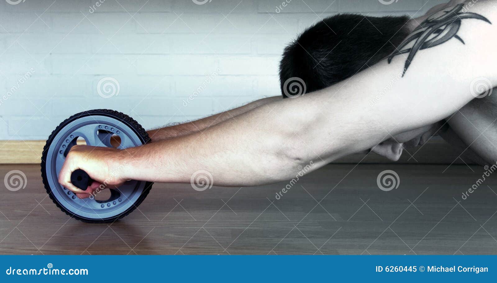 Man on an Exercise Wheel stock image. Image of lifestyle - 6260445